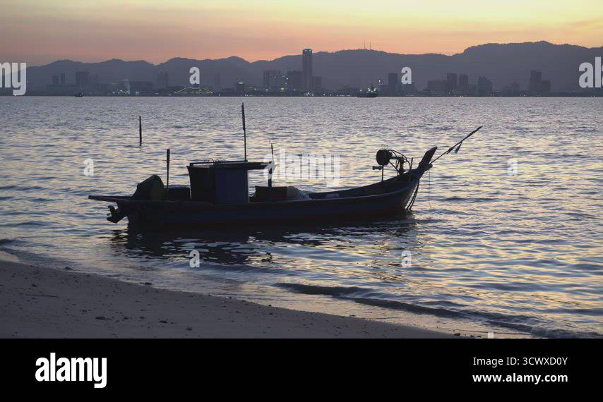 Fishing boat with background KOMTAR building Stock Video Footage - Alamy