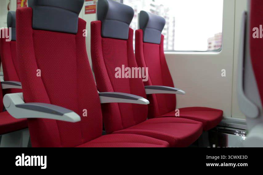 Red chairs in train Stock Video Footage - Alamy