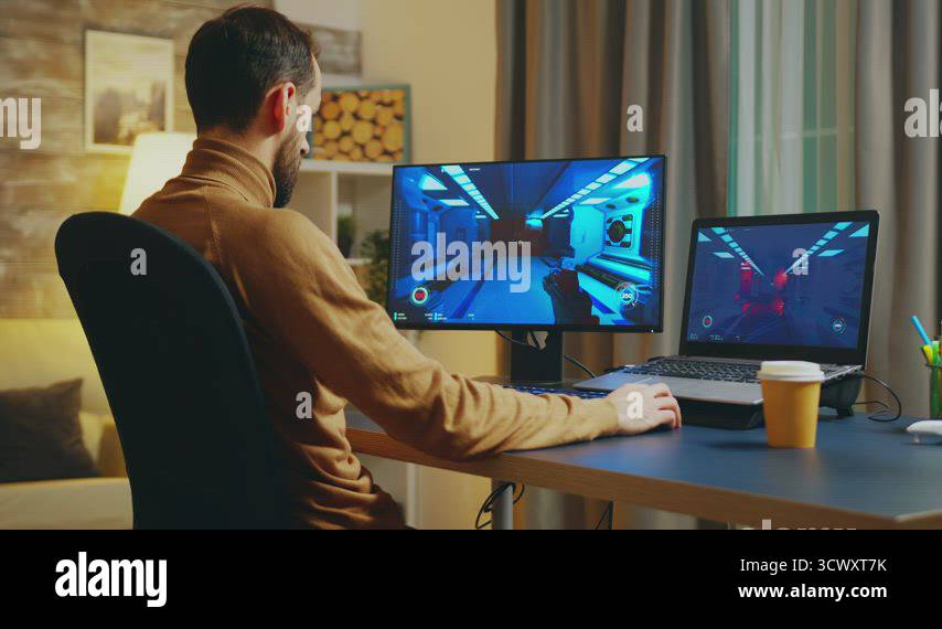 Engineer playing video games at home on computer Stock Video Footage ...