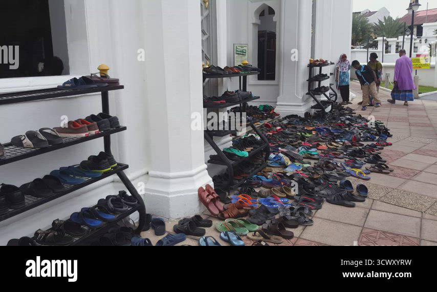 Muslim arrange the shoes properly outside the church Stock Video ...