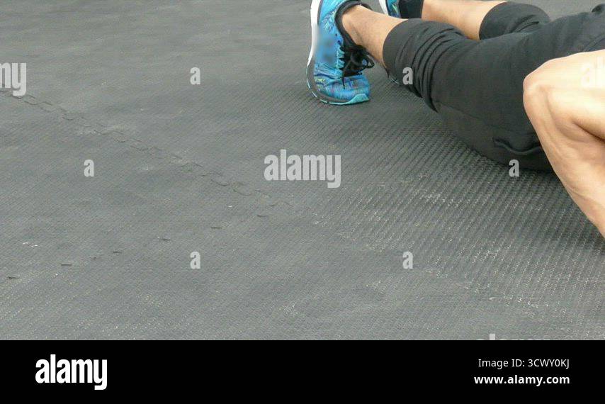 young muscle man doing plank position in gym. bodybuilder male working ...