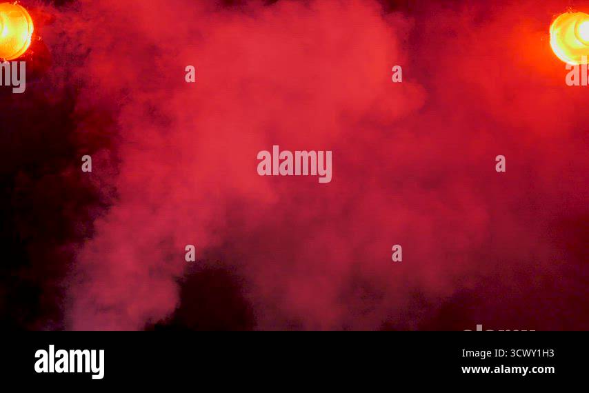 Dispersing red fumes over a black background Stock Video Footage - Alamy