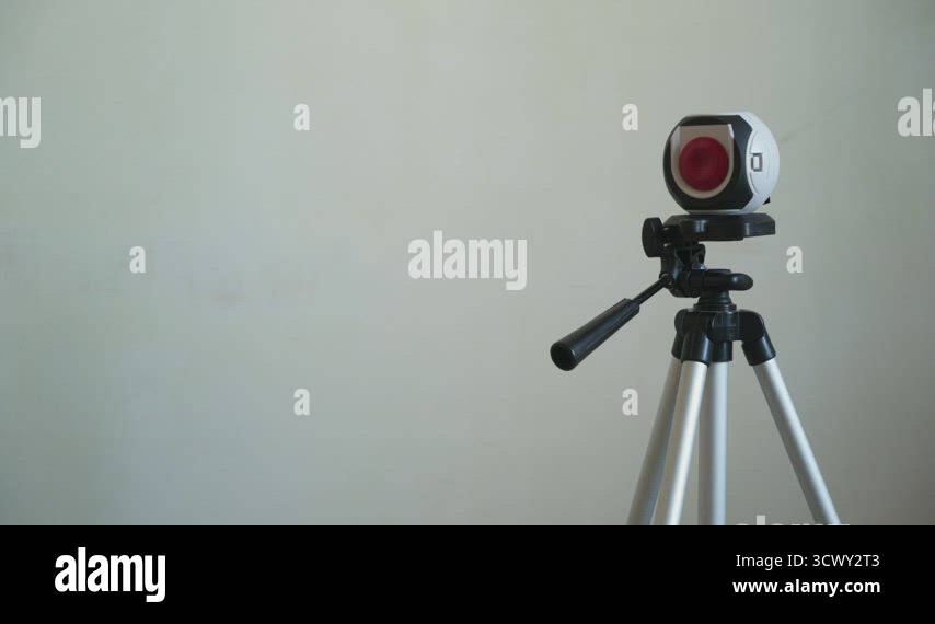 Laser Level measuring tool with visible red laser beam crossing Stock ...