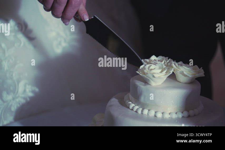 Woman cutting celebration cake Stock Video Footage - Alamy