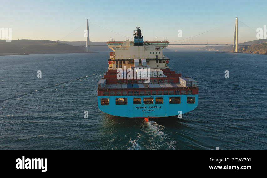 Aerial following from behind the MAERSK LINEs KAMPALA Container Ship ...