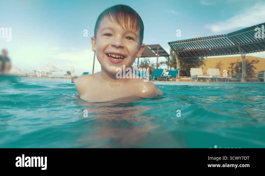 He likes to splash water in the pool, it's so funny Stock Video Footage ...