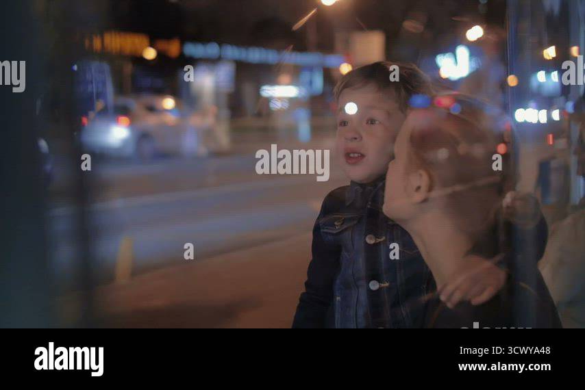 Mother and curious son in night city Stock Video Footage - Alamy