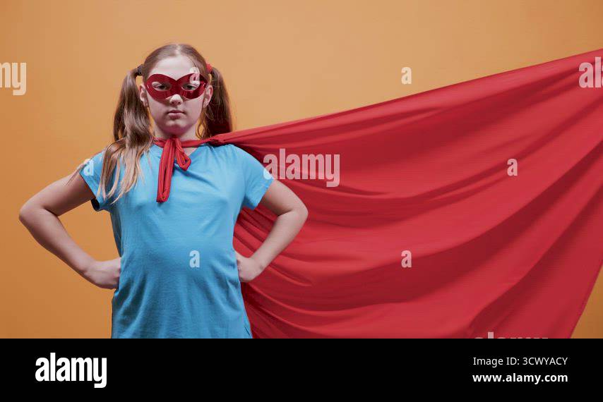 CINEMAGRAPH - Little girl dressed in superhero with the cloak getting ...