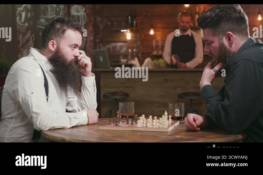 Male friends with beards met in a bar to play a chess game Stock Video ...