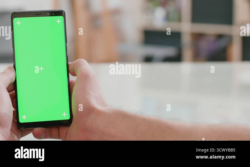 Smooth slide motion with a green screen on a smartphone display Stock ...
