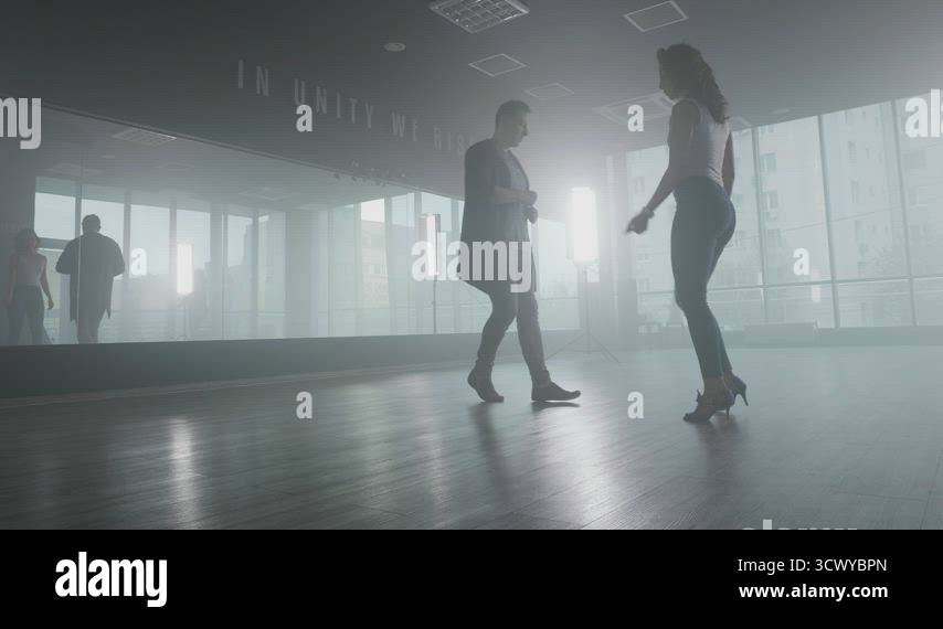Silhouettes of two dance partners dancing kizomba Stock Video Footage ...