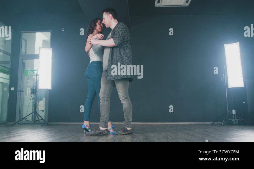 Dance partners in a professional dance studio preparing new kizomba ...