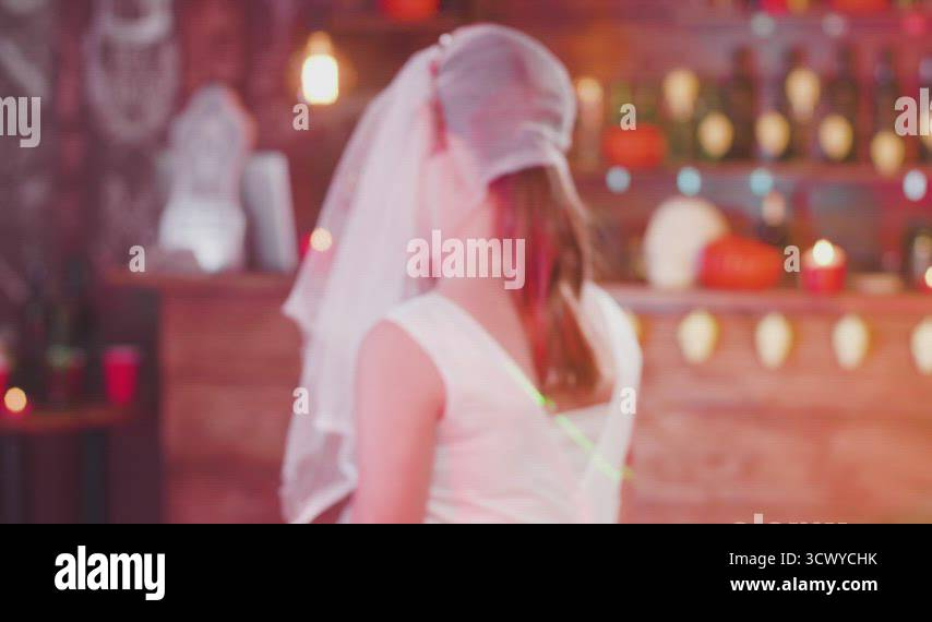Teenage girl dressed in halloween costume of a dead bride stained in ...