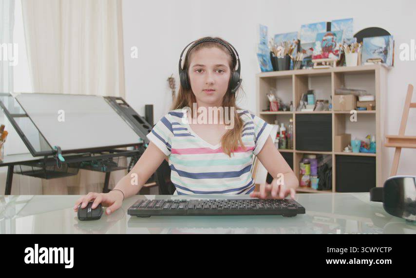 Kid gets mad after losing a game on the computer and leaves Stock Video ...