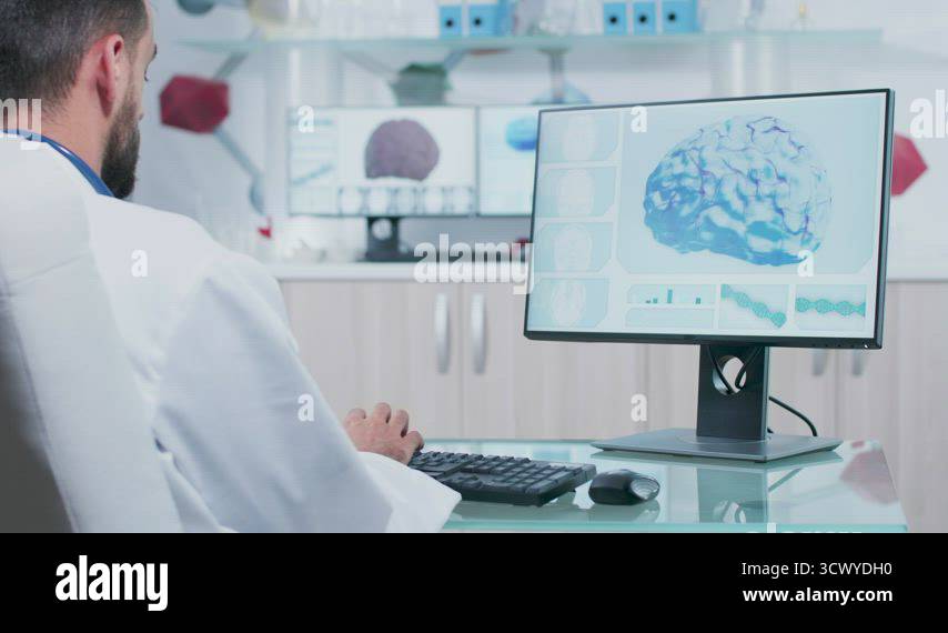 Over the shoulder shot of doctor in research facility looking at 3D ...