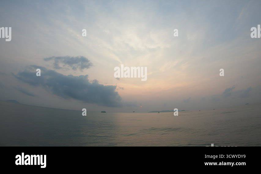 Time lapse motion sea waves and boat Background clouds are moving fast ...