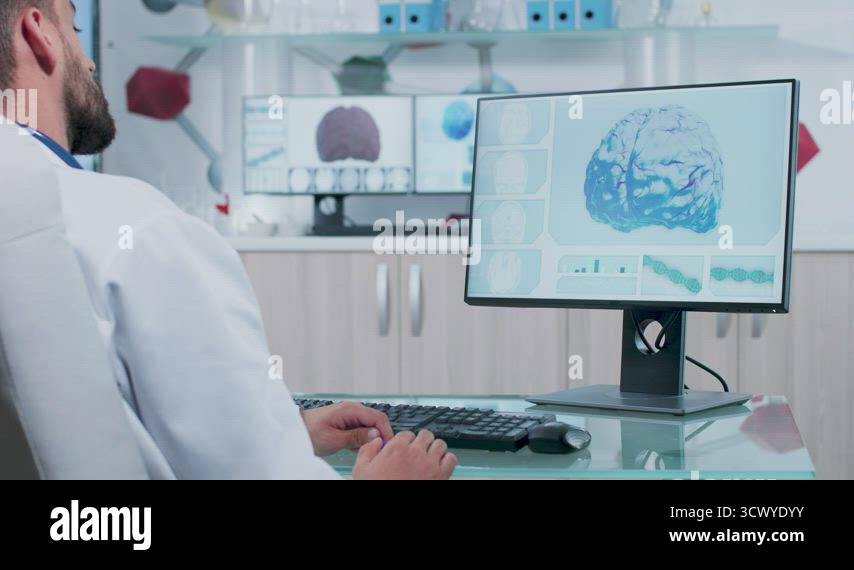 Doctor analyzing 3D brain simulation on a computer screen Stock Video ...