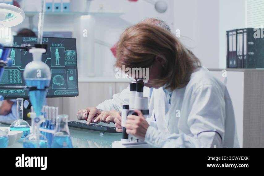 Science team working in modern Stock Videos & Footage - HD and 4K Video ...
