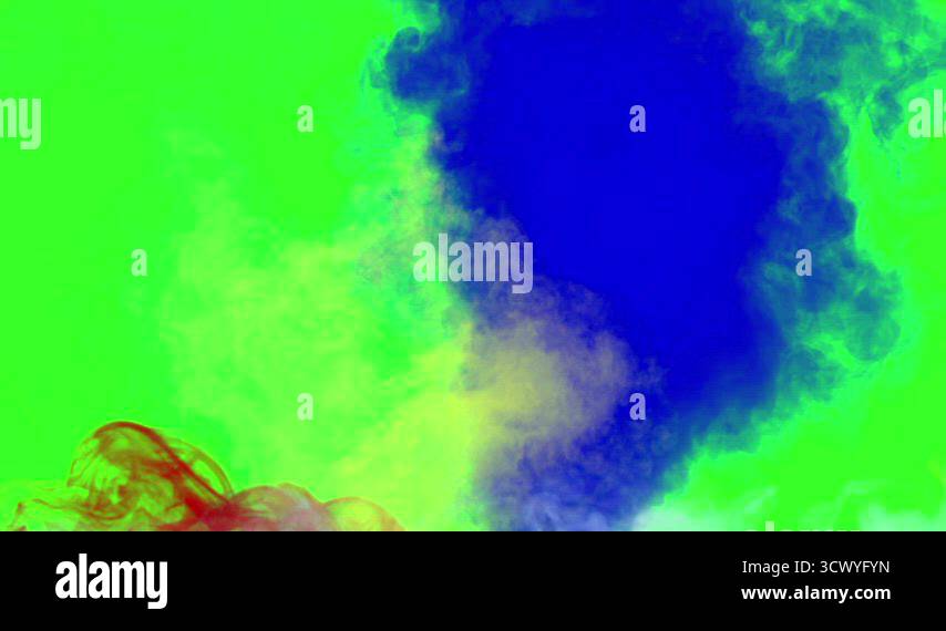 Colorfull smoke slowly floating through space against green screen ...
