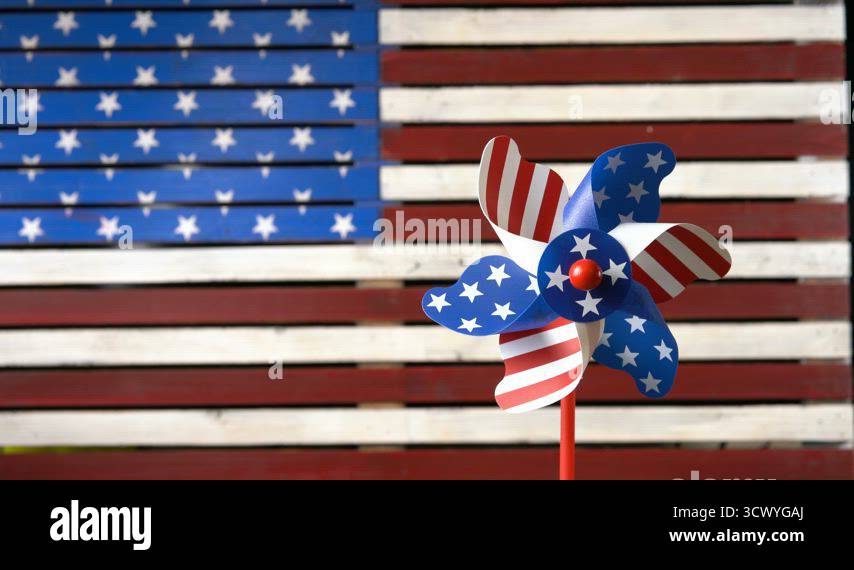 Pinwheel or whirligig in front of US flag Stock Video Footage - Alamy