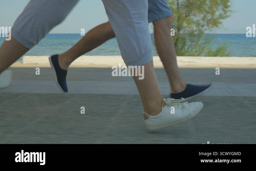 Two people running along sea Stock Videos & Footage - HD and 4K Video ...