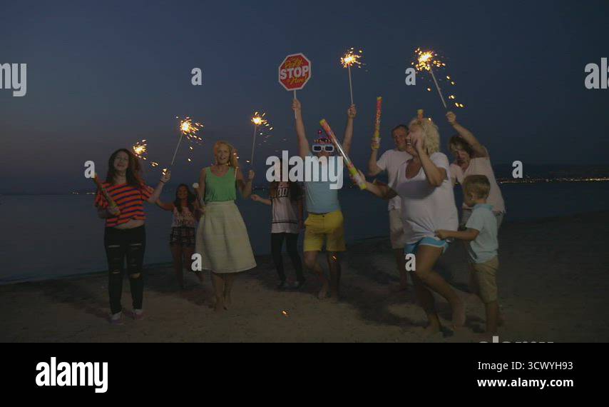 People having night party on the beach Stock Video Footage - Alamy