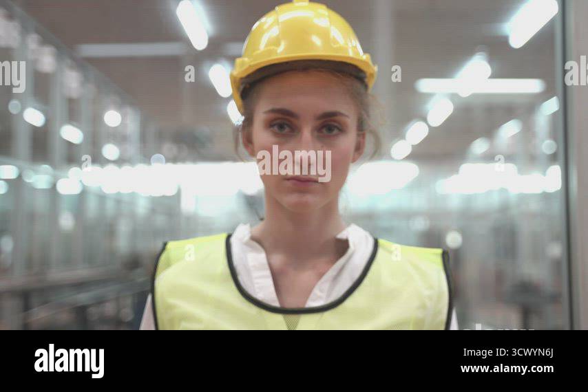 Labor woman worker is wearing protection mask face and safety helmet ...