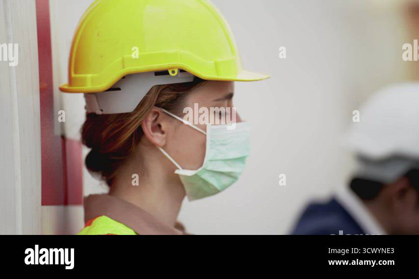 Labor woman worker sitting relaxing after work at outdoor warehouse ...