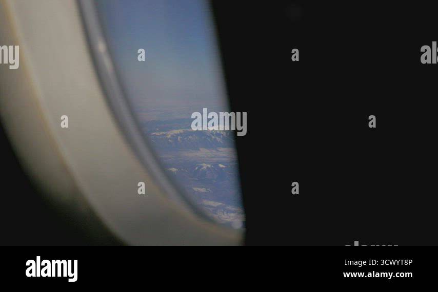 Aircraft wing and picturesque mountain landscape from high level from ...