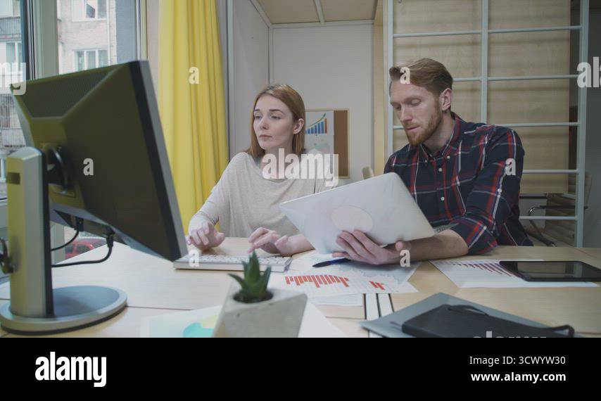 Boss gives an indication of the employee, the girl quickly perform the task Stock Video Footage ...