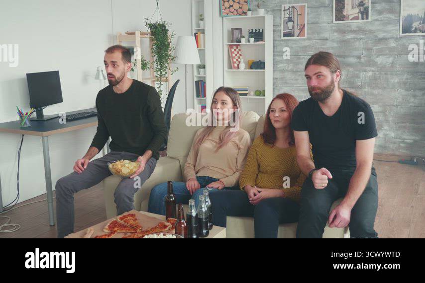 Over excited group of friends celebrating victory Stock Video Footage ...