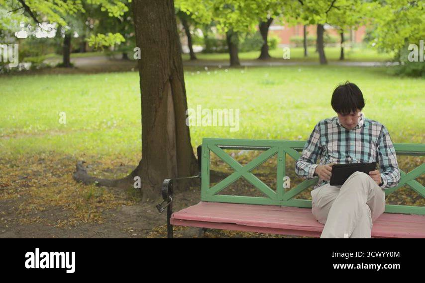 Young man playing computer game arcade at tablet Stock Video Footage ...