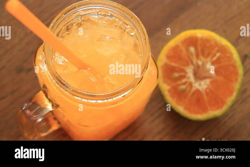 Refresh drink with honeysuckle orange juice Stock Video Footage - Alamy