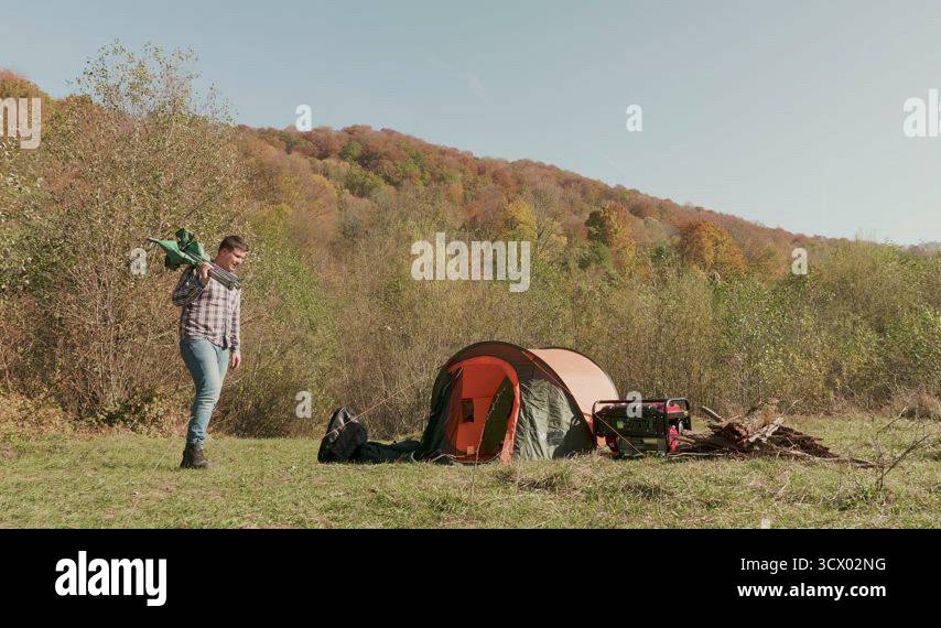 Couple enjoyint their time together on a camp site Stock Video Footage ...