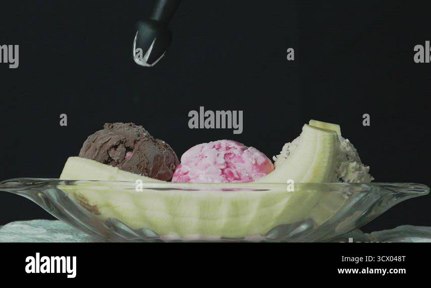 Ice cream Banana Split in glass topped whip cream Stock Video Footage ...