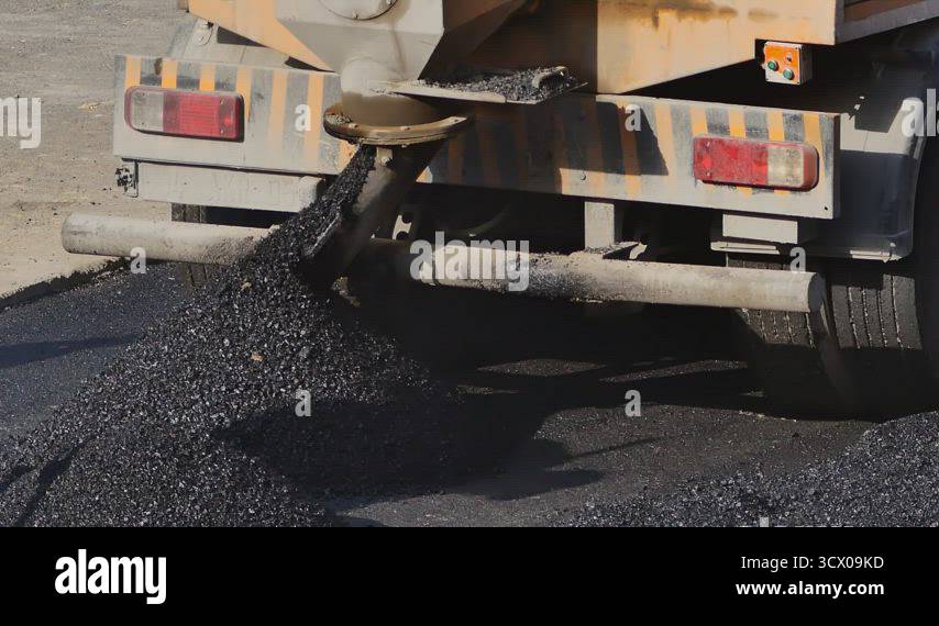 Dump truck unloads asphalt Stock Videos & Footage - HD and 4K Video ...