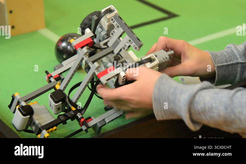 Child fixing robot during football game Stock Video Footage - Alamy