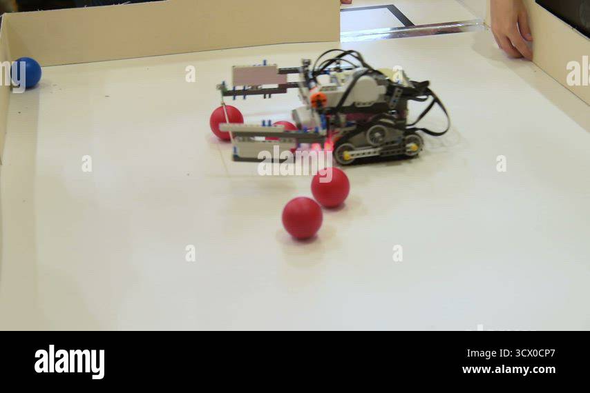 Robot collecting balls Stock Video Footage - Alamy