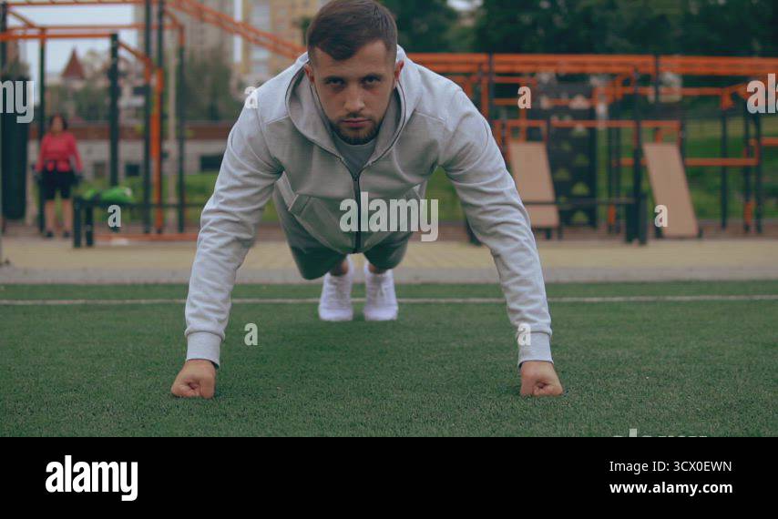 man is doing push ups on the ground Stock Video Footage - Alamy