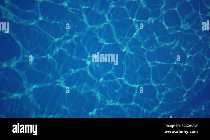 Water in the pool, sunlight is reflected, waves. Reflection and glare ...