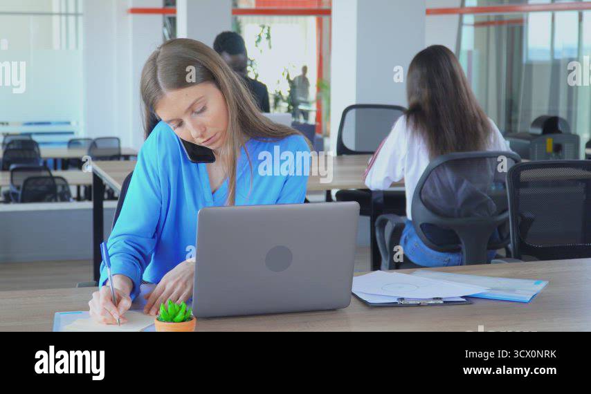 multitasking manager intern with blond hair at workplace Stock Video ...