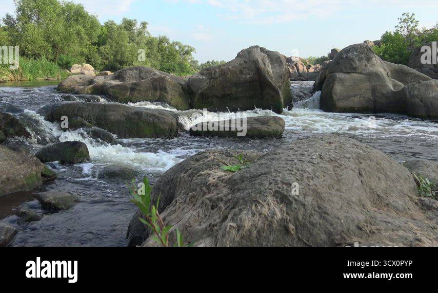 Granite rapids and rapids with rapidly flowing water on the South Bug River, Ukraine Stock Video ...