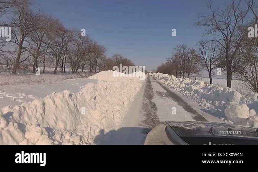 Snow drifts on the road. Abnormally cold winter in Ukraine, Bolgrad ...