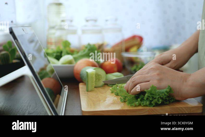 4K. female hand slicing green vegetable, prepare ingredients for ...