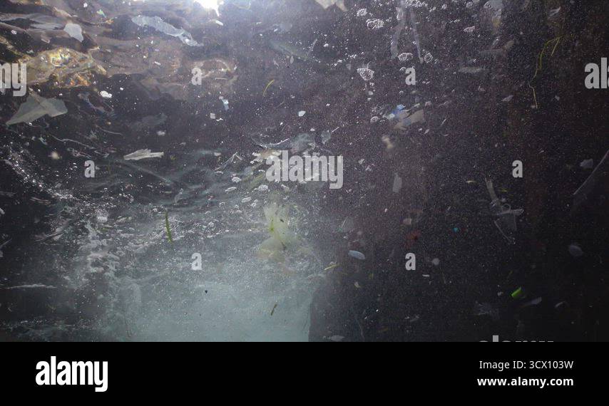 Plastic garbage and other debris floating underwater. Marine pollution ...
