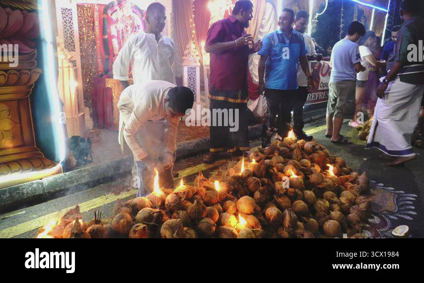 Some coconuts is lit up before coconut smash ritual Stock Video Footage ...