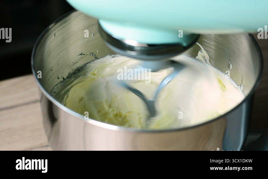 Closeup of stand mixer mixing butter to make cake and cookies Stock ...