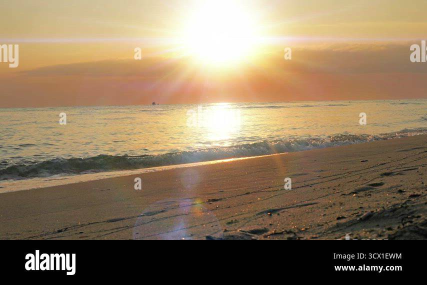 sunrise over sea sun ray beach 4k Stock Video Footage - Alamy