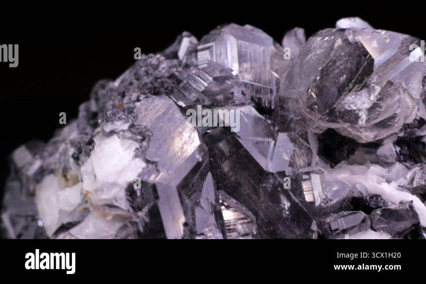 Cerussite crystals macro video slowly rotating over a black background ...