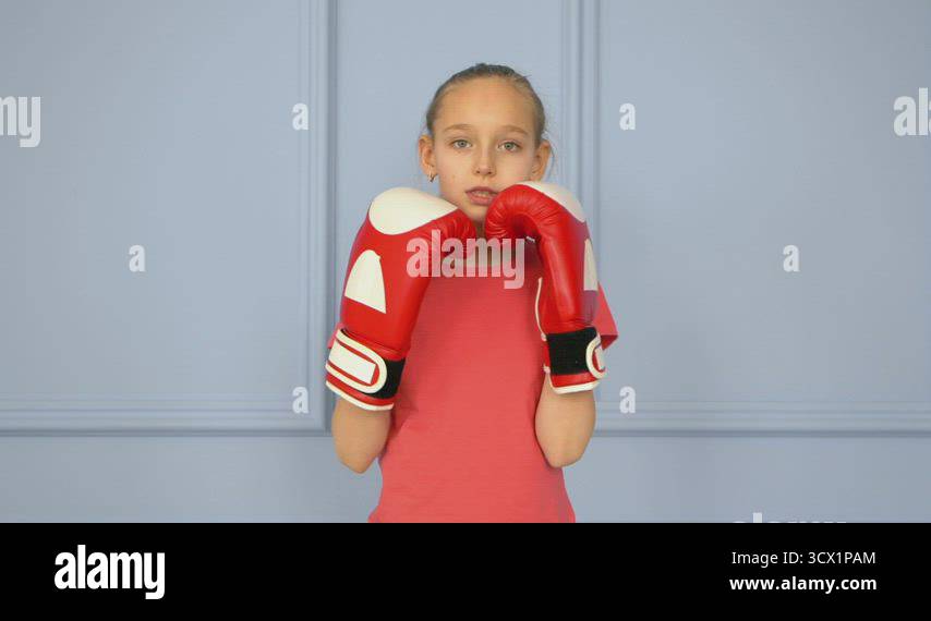 Teenager girl in boxing gloves training fight slow motion. Boxing ...